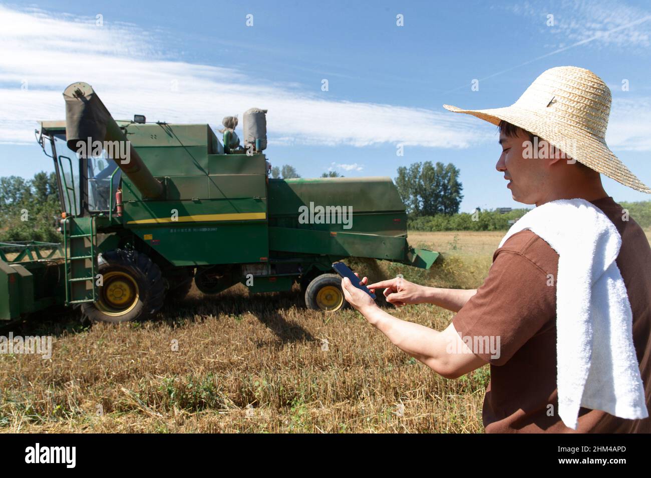 Farmers stand in the catcher in the use of mobile phones Stock Photo ...