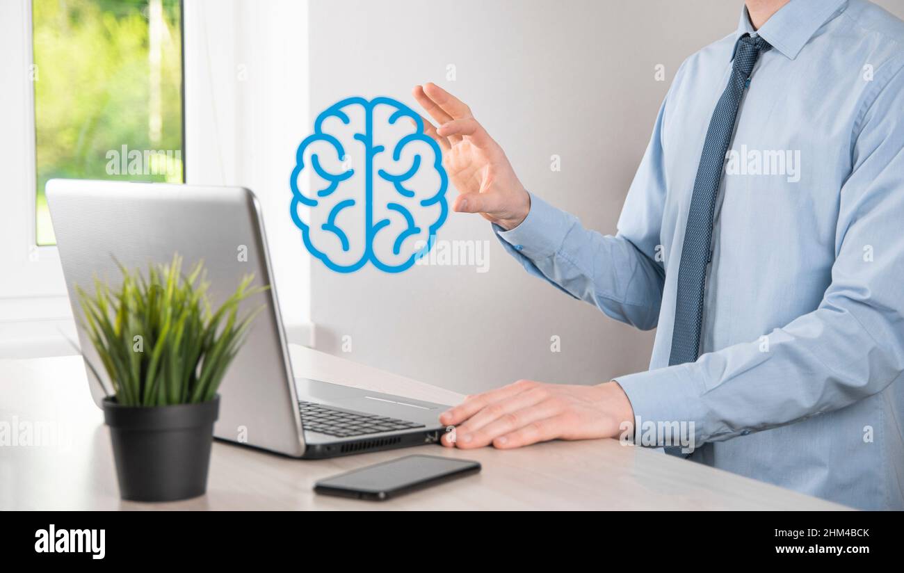 Businessman holding abstract brain and icon tools, device, customer ...