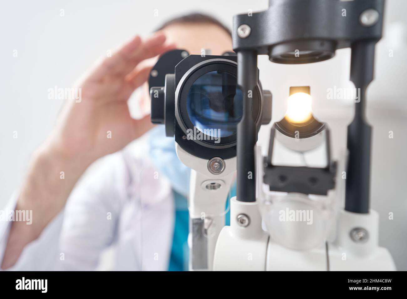 Ophthalmologist using medical equipment in the hospital Stock Photo - Alamy