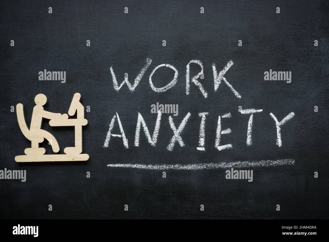 Handwritten sign work anxiety on the blackboard Stock Photo - Alamy
