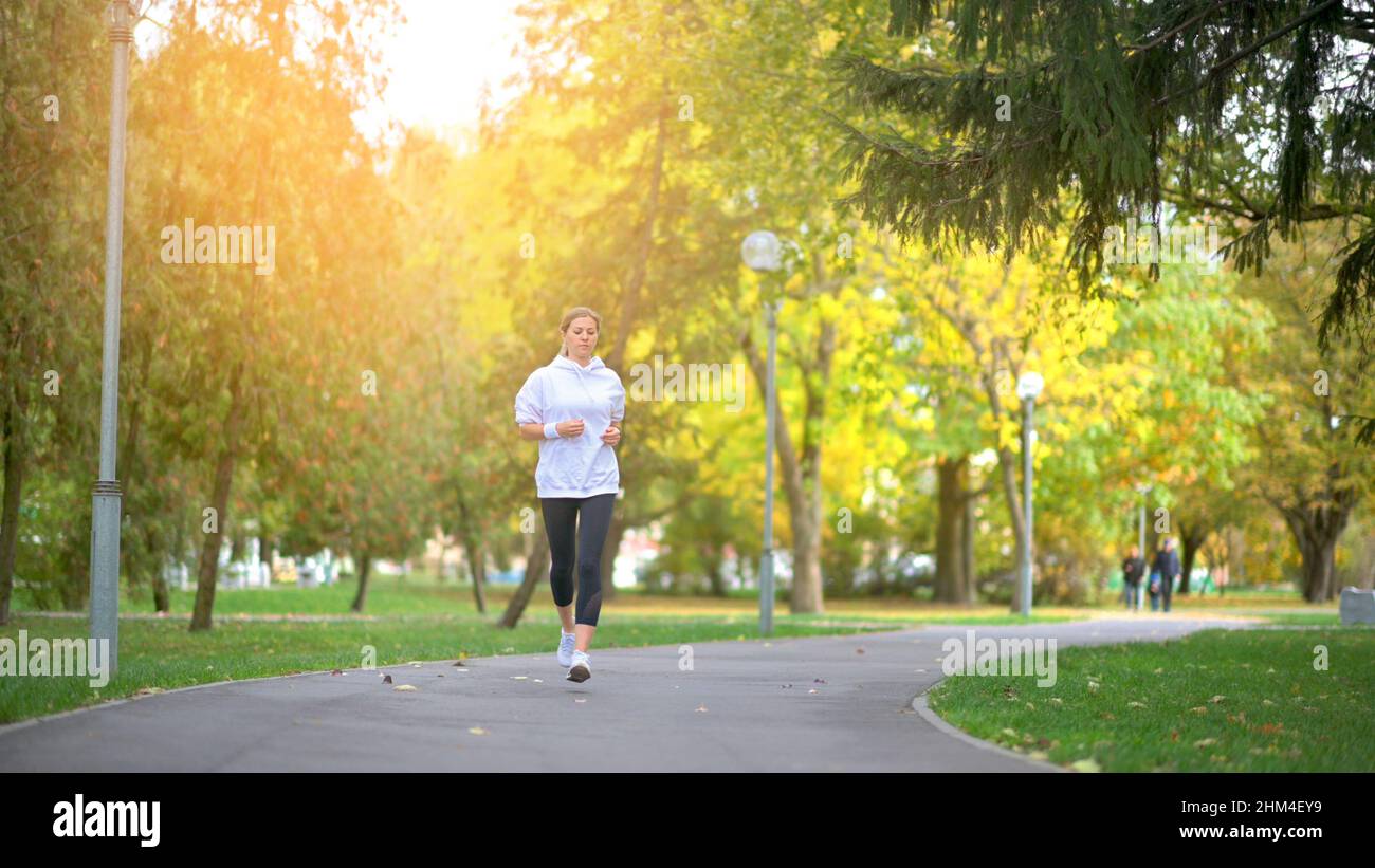 Girl athlete jogging in the park. Workout. Healthy lifestyle Stock ...