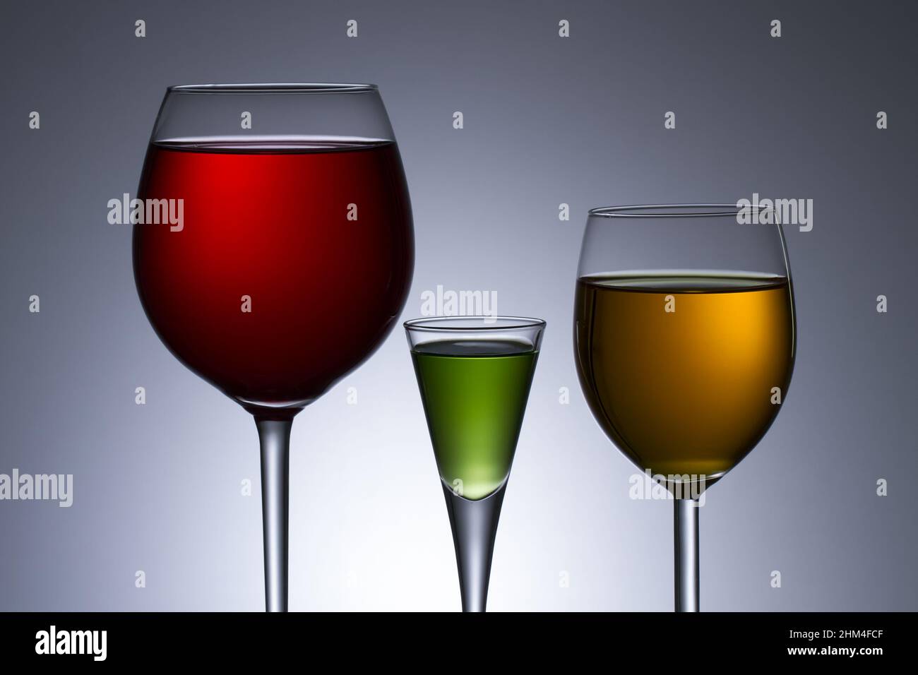 Three Colors of alcohol in glass Stock Photo - Alamy
