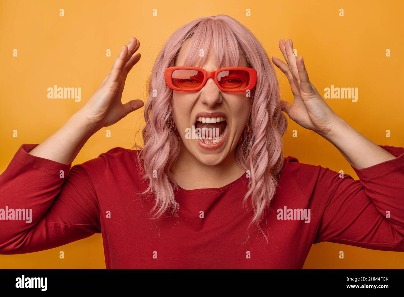 Stressed emotional angry 30s woman standing with hand on head for pain ...