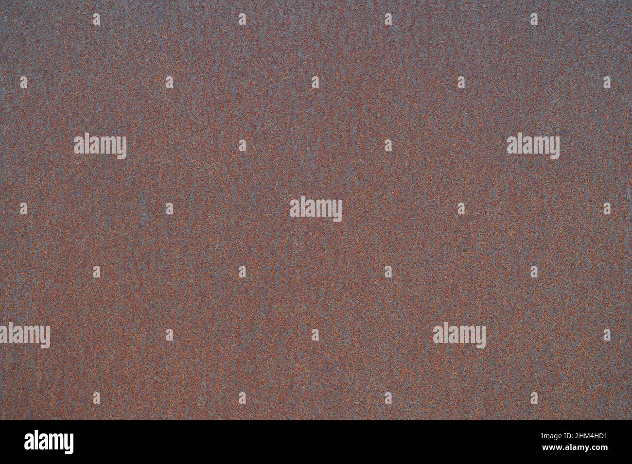 Rusty dark metal sheet with uniform corrosion in uniform lighting ...