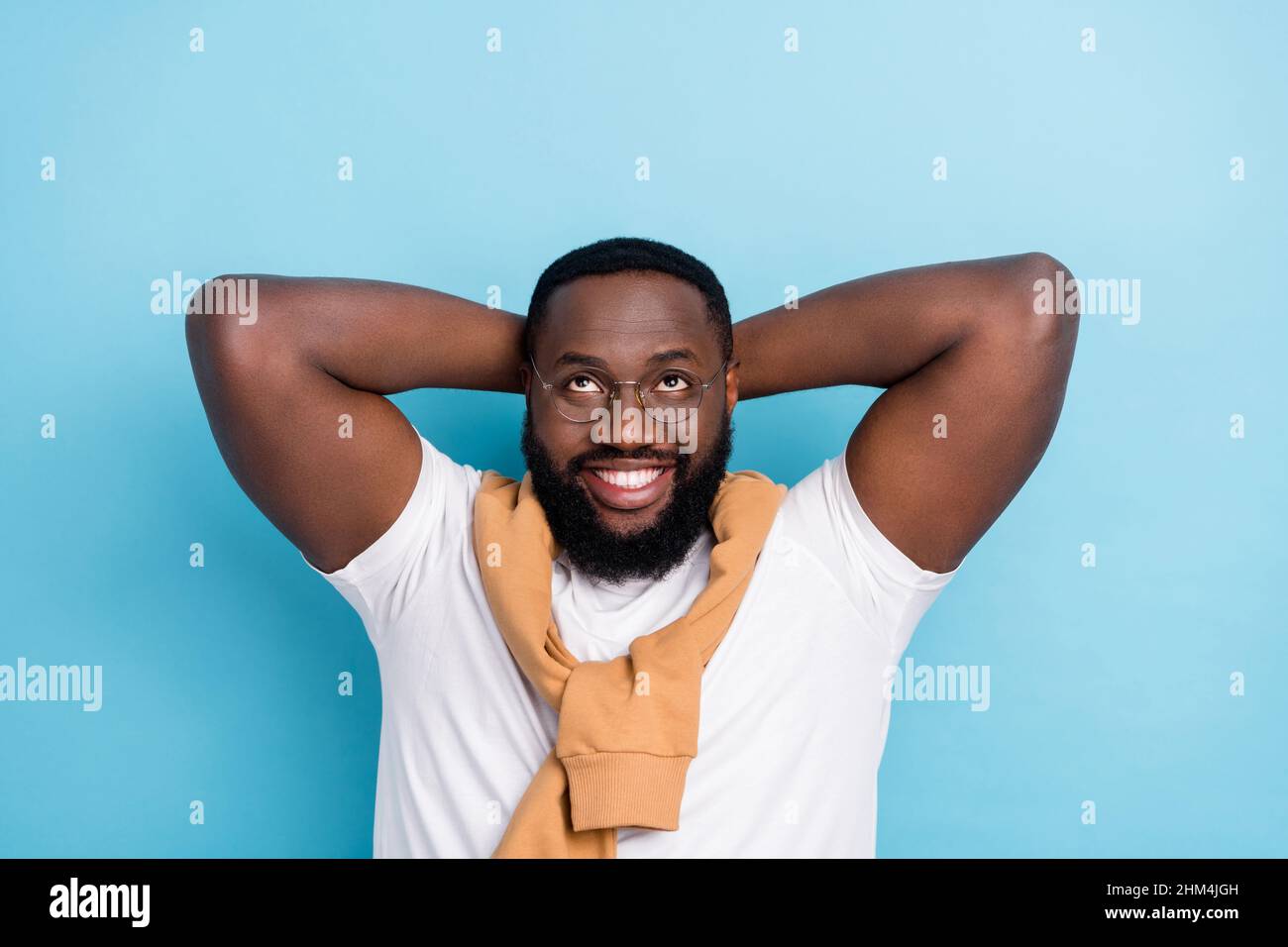 Photo of dreamy guy enjoy rest look empty space wear specs white t ...