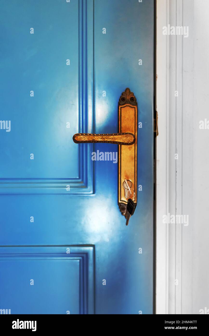 Blue front door with gilded lock and handle Stock Photo - Alamy
