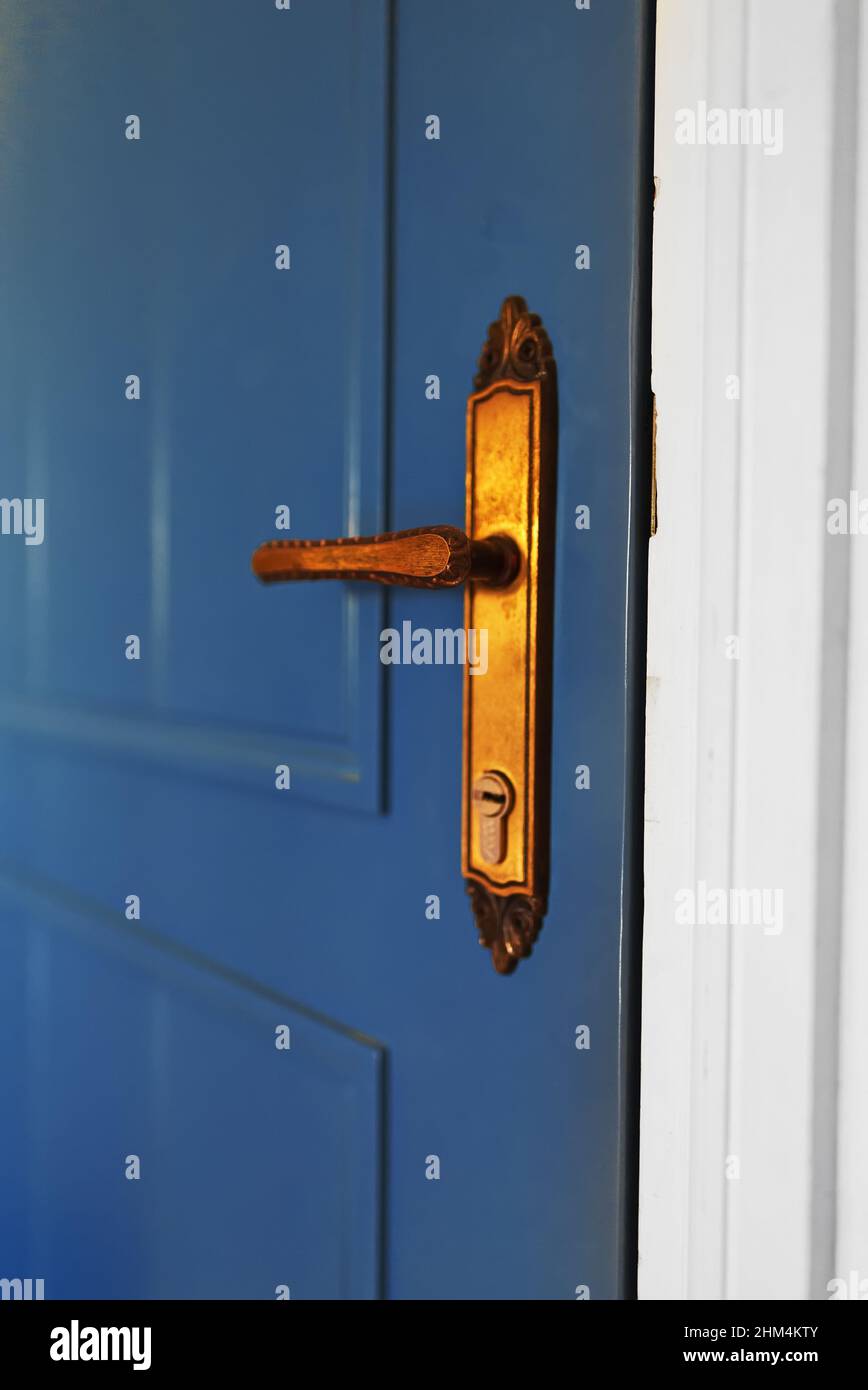 Blue front door with gilded lock and handle Stock Photo - Alamy