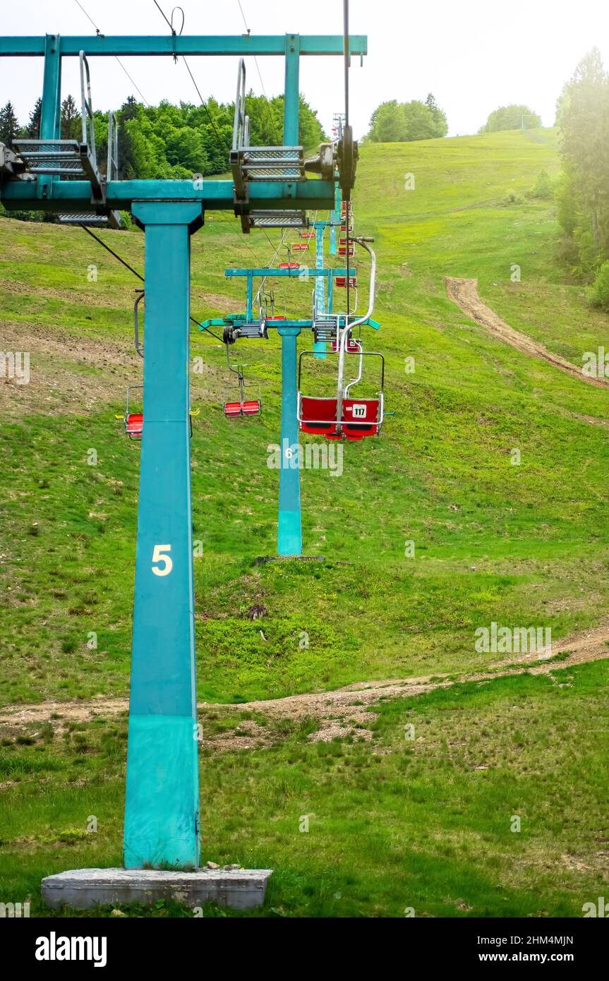 Chairlift at the ski resort, view from below. Elevator in the summer ...