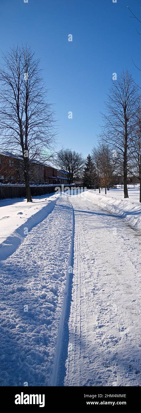 Panoramic vertical photo of the footpath with deep snow for a winter ...