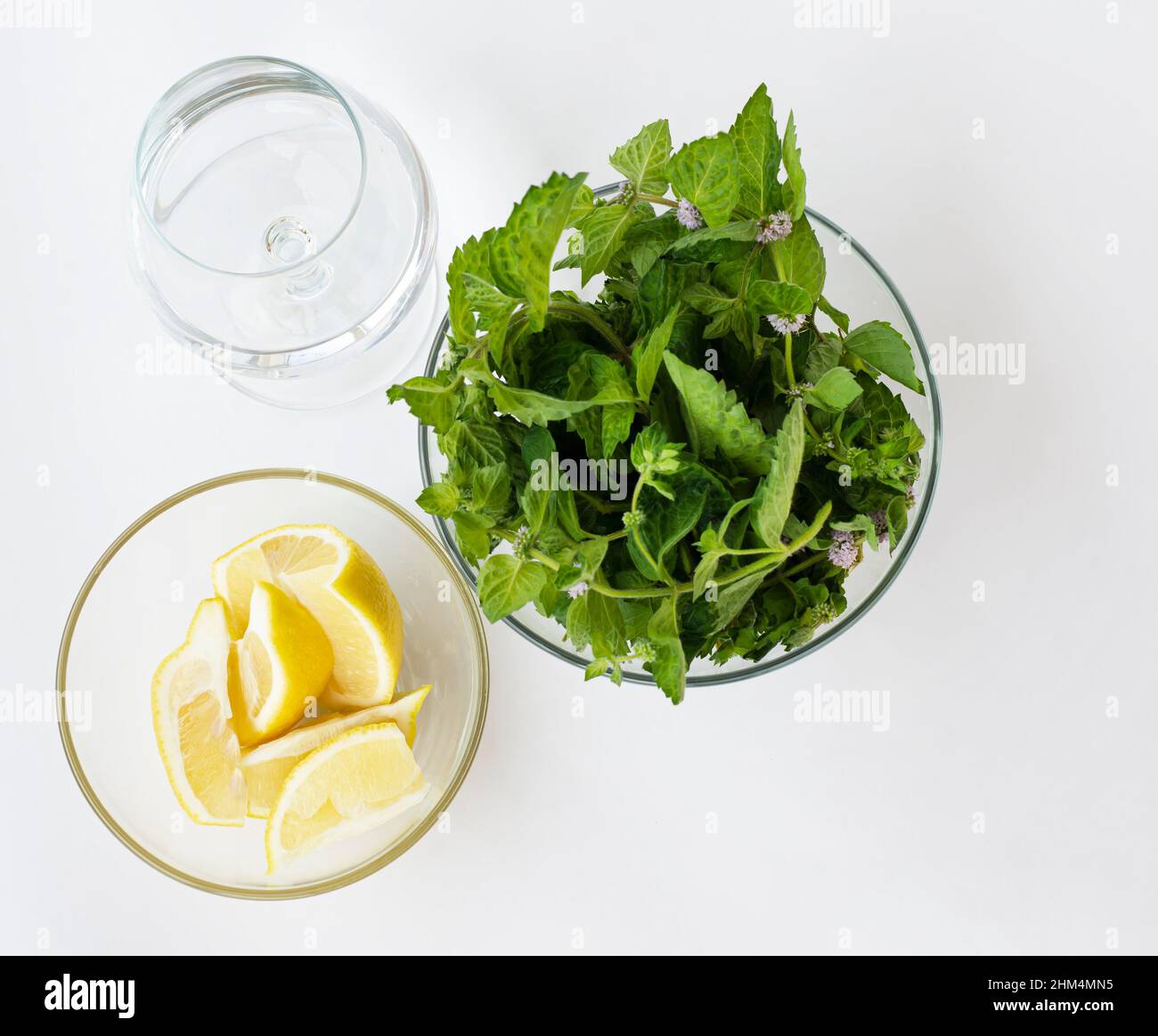Three glass vessels. View from above. Wine glass with clean water. Cup ...