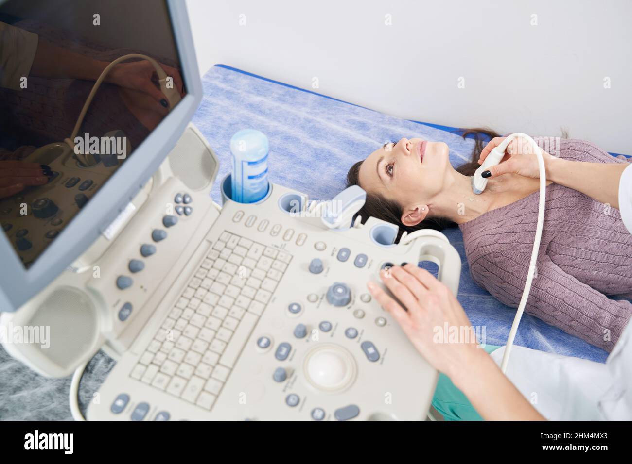 Young patient getting ultrasound exam in clinic Stock Photo - Alamy