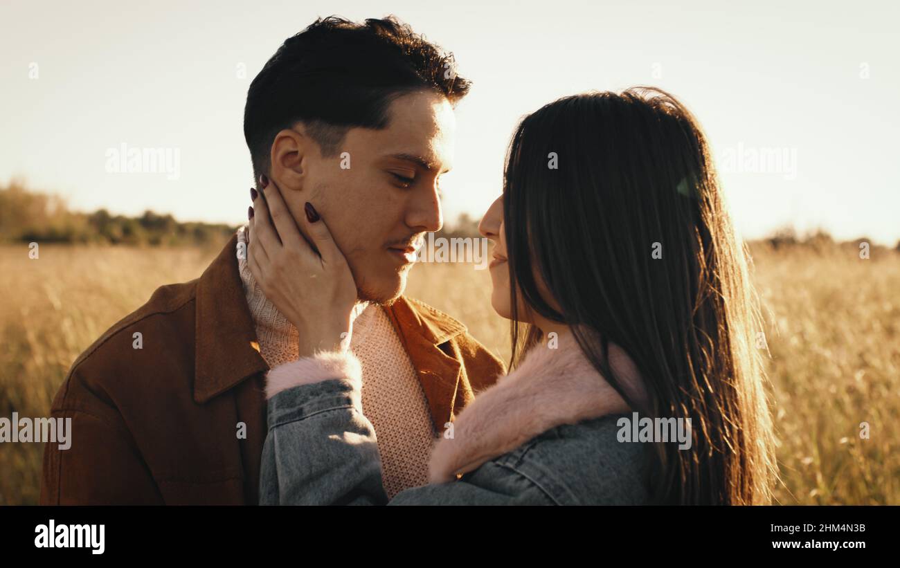 Couple Hugs Each Other outdoor At Sunset light Stock Photo - Alamy