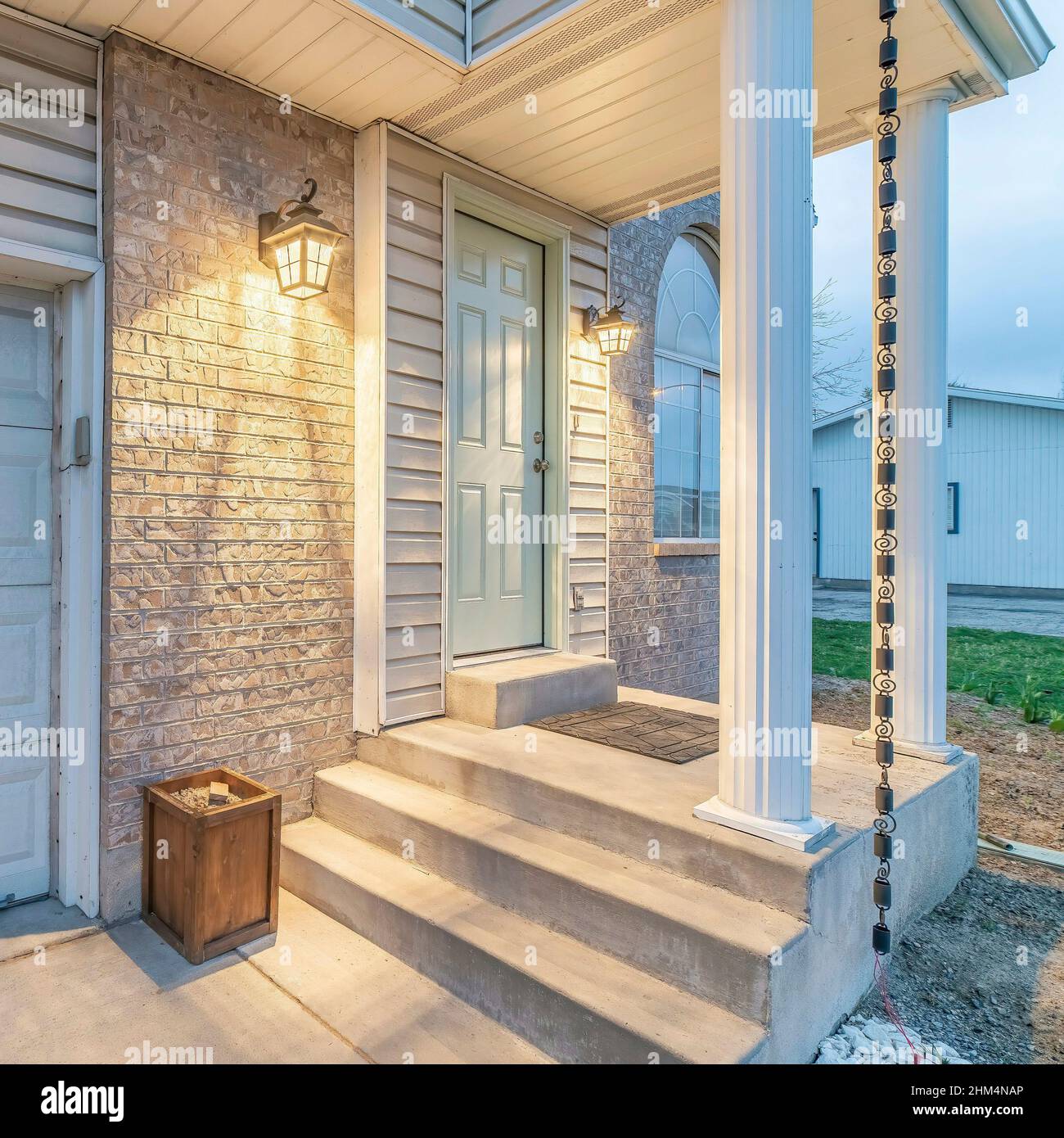 Square Exterior of a house with stone veneer siding and sectional ...