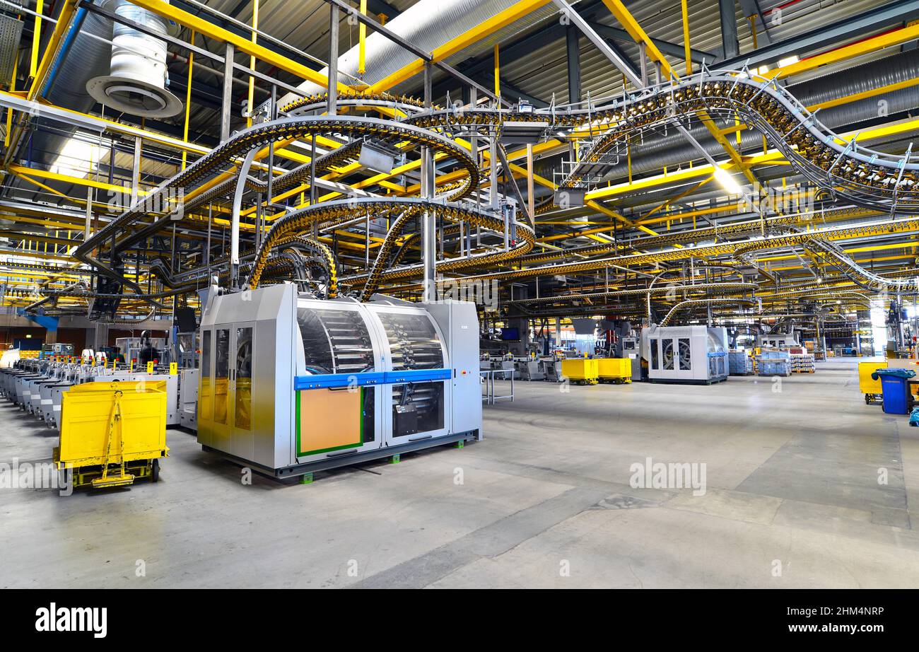 modern machines for transportation in a large print shop for production ...