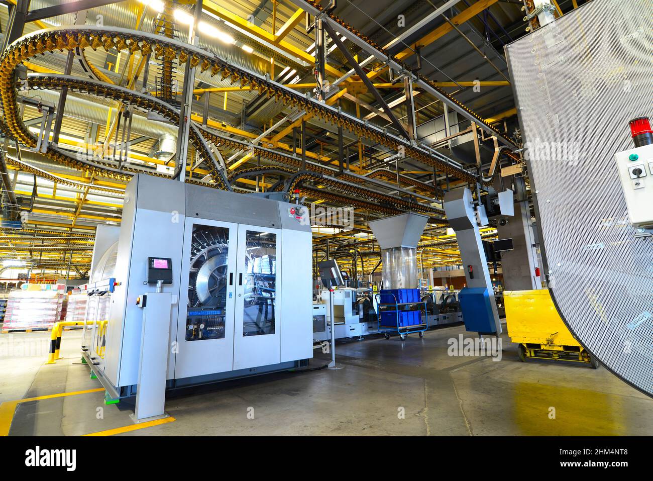 modern machines for transportation in a large print shop for production ...