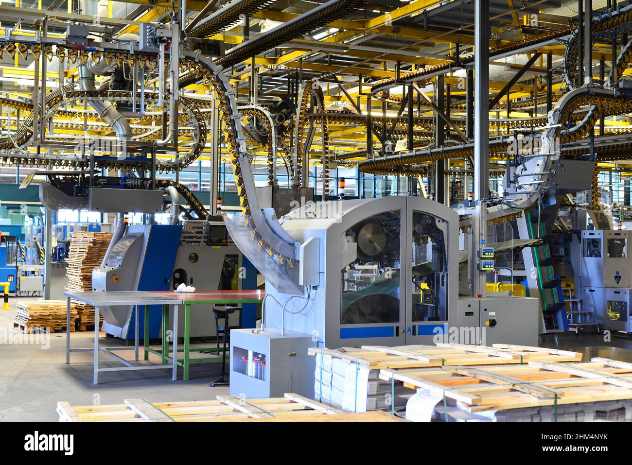 modern machines for transportation in a large print shop for production ...