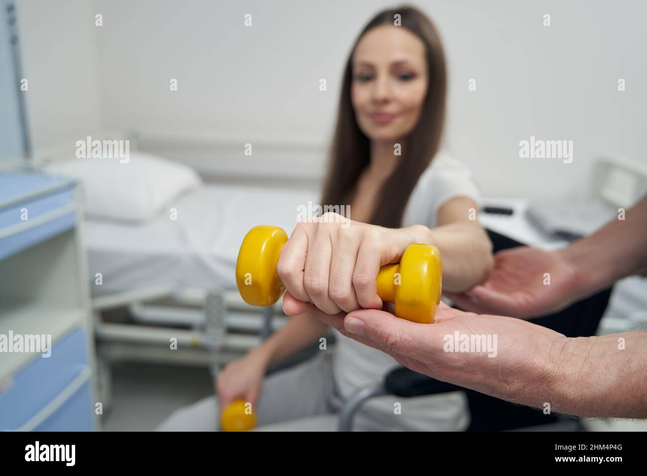 Female patient undergoing medical rehabilitation in hospital Stock ...