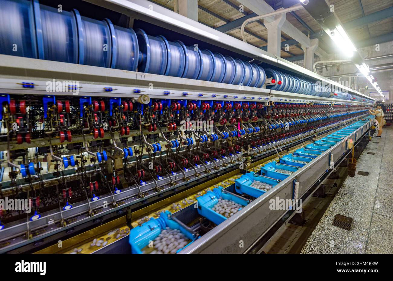 Silk reeling workshop processing Stock Photo - Alamy