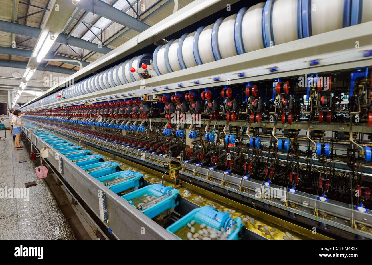 Silk reeling workshop processing Stock Photo - Alamy