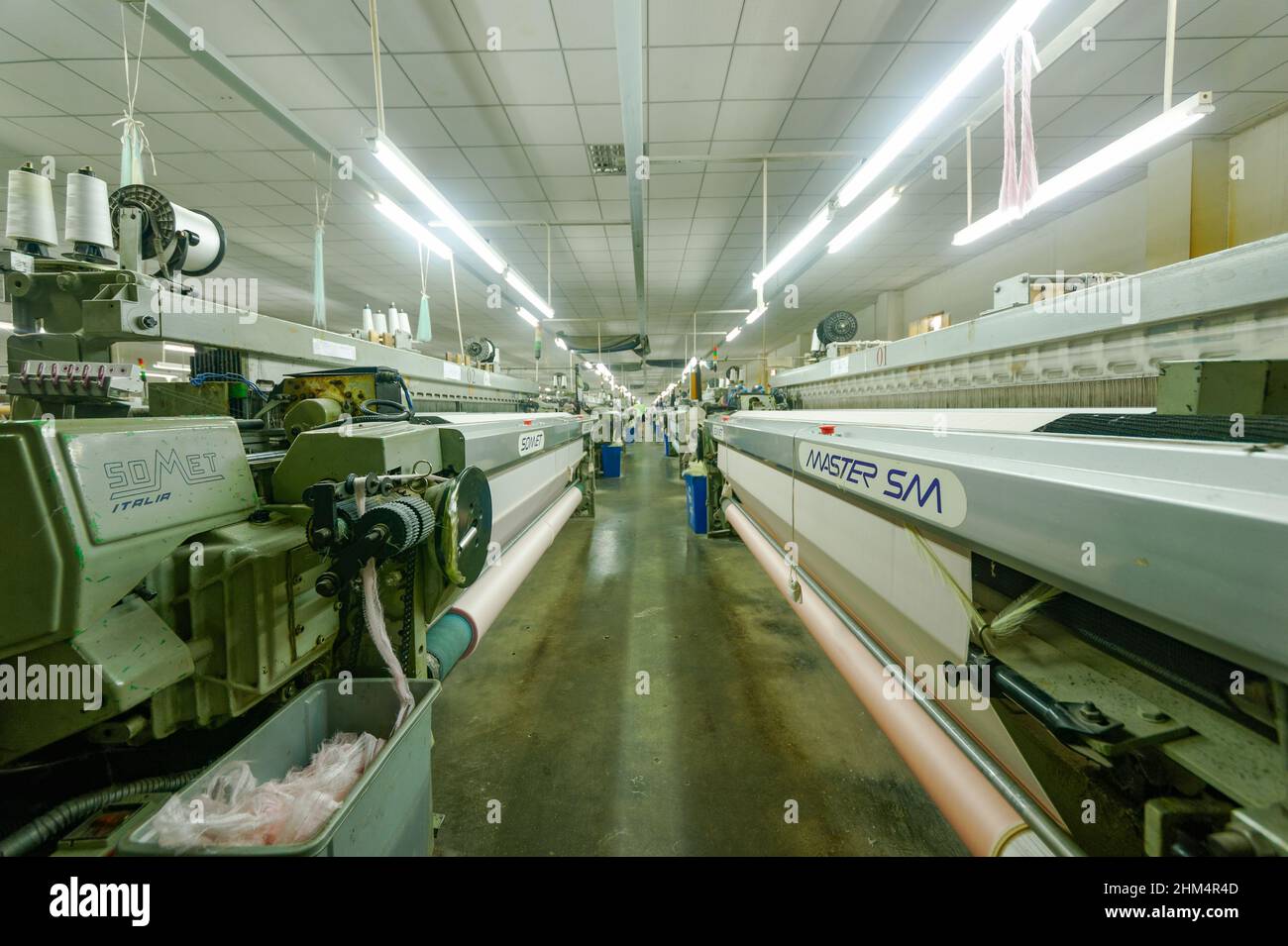 Silk reeling workshop processing Stock Photo - Alamy
