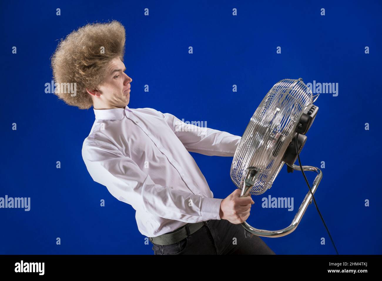 Funny man. Fun. Humor. Hair develops in the wind. Strong air flow. A ...