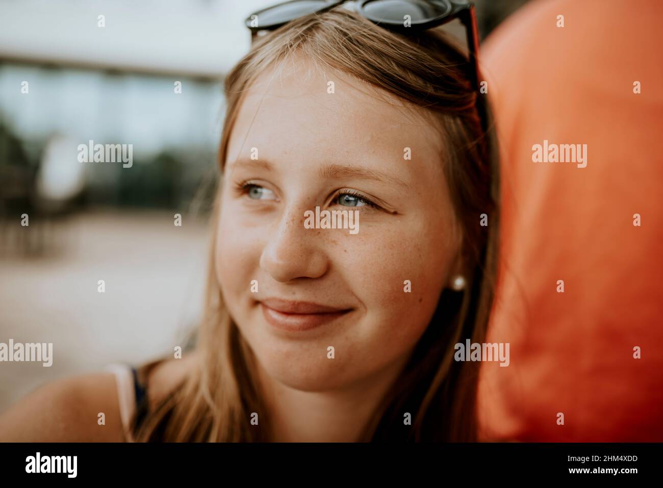 Smiling teenage girl looking away Stock Photo - Alamy