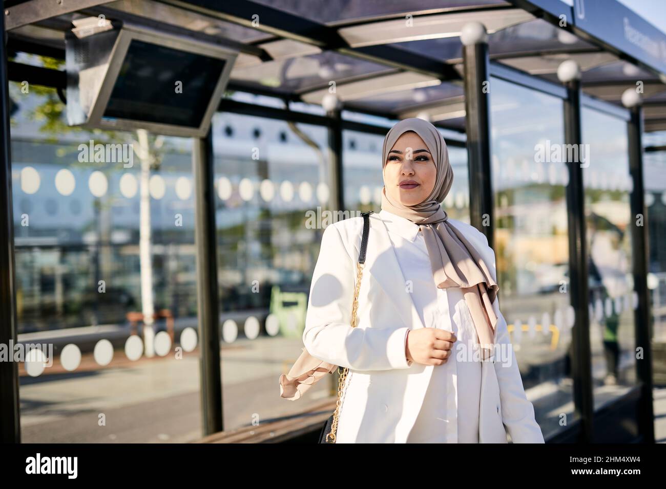 Woman standing bus stop hi-res stock photography and images - Alamy
