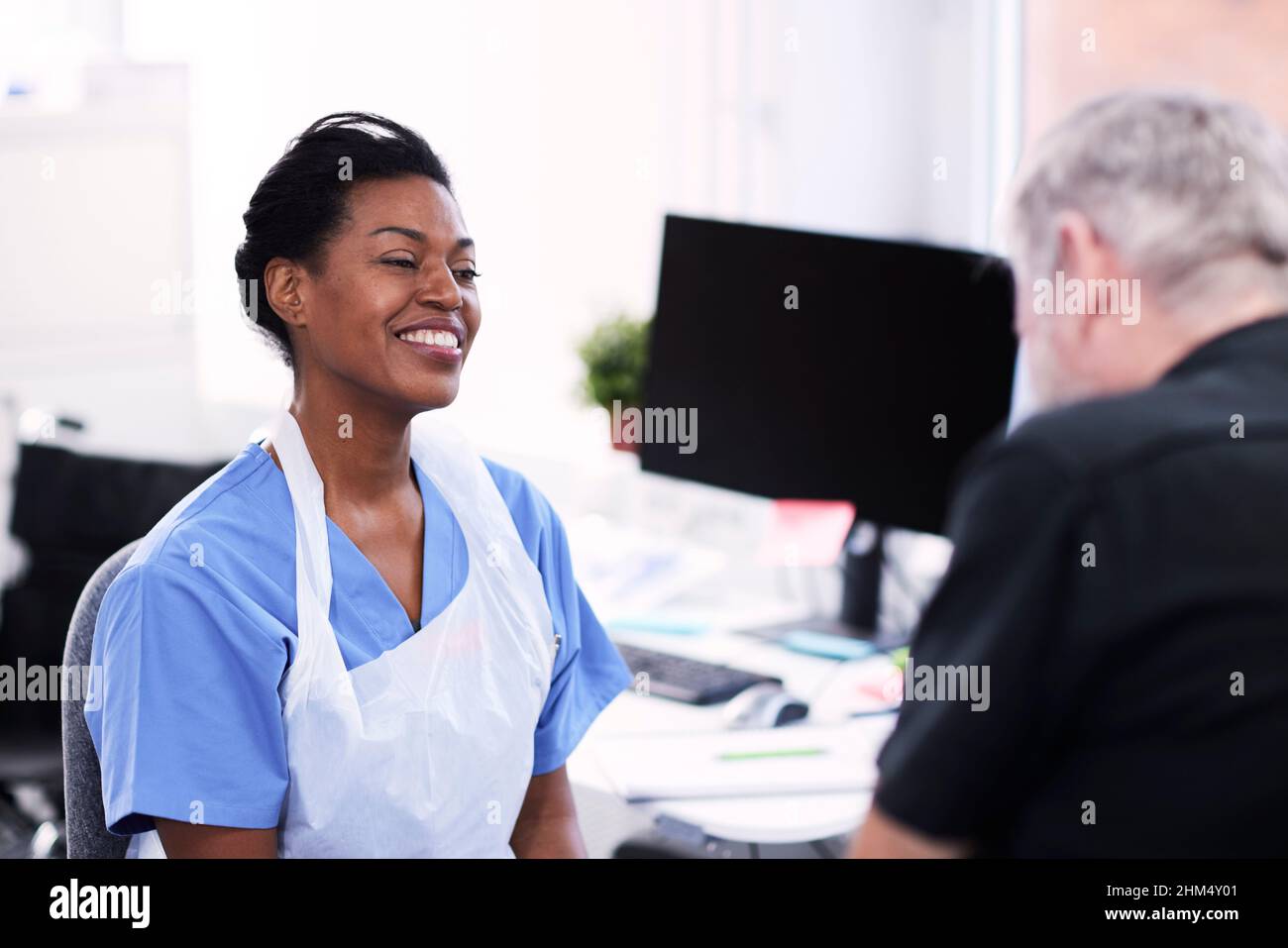 Care worker smiling patient hi-res stock photography and images - Alamy