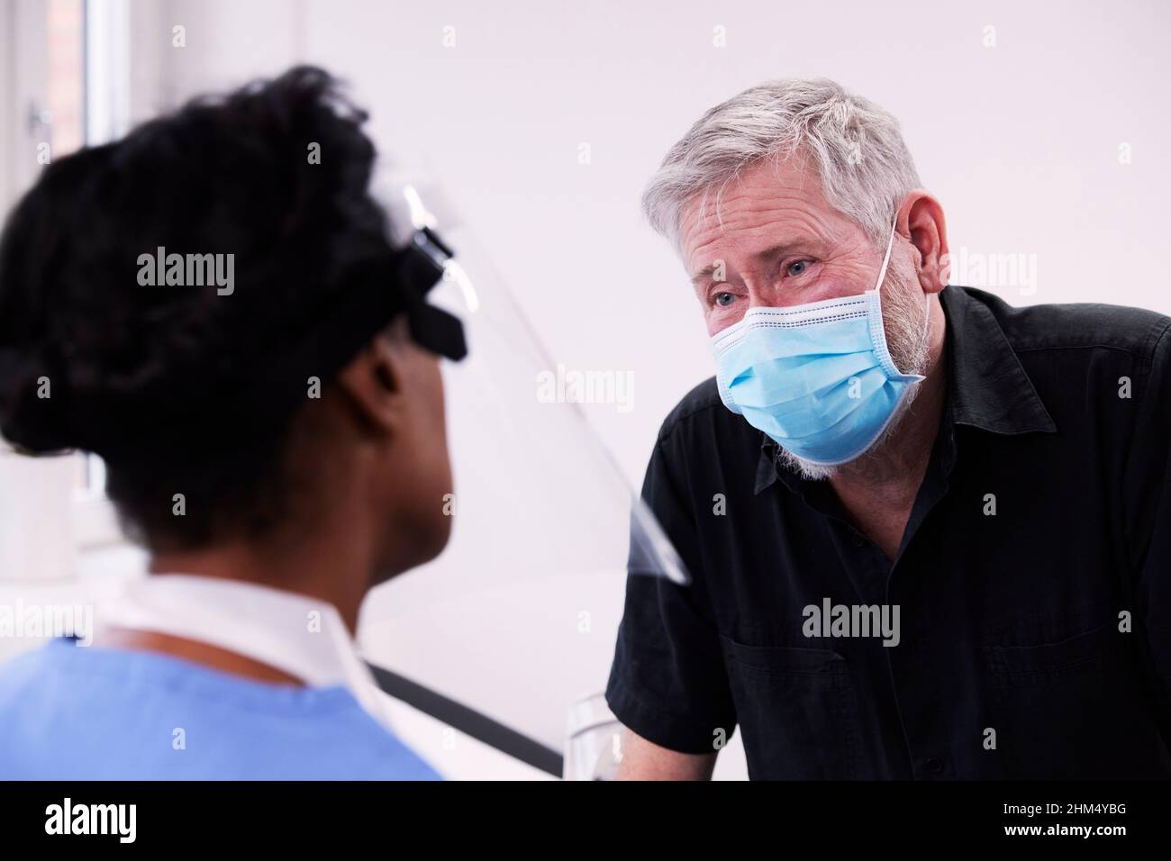 Doctor examine mask hi-res stock photography and images - Alamy