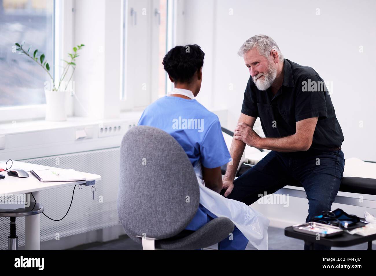 Old man care worker hi-res stock photography and images - Alamy