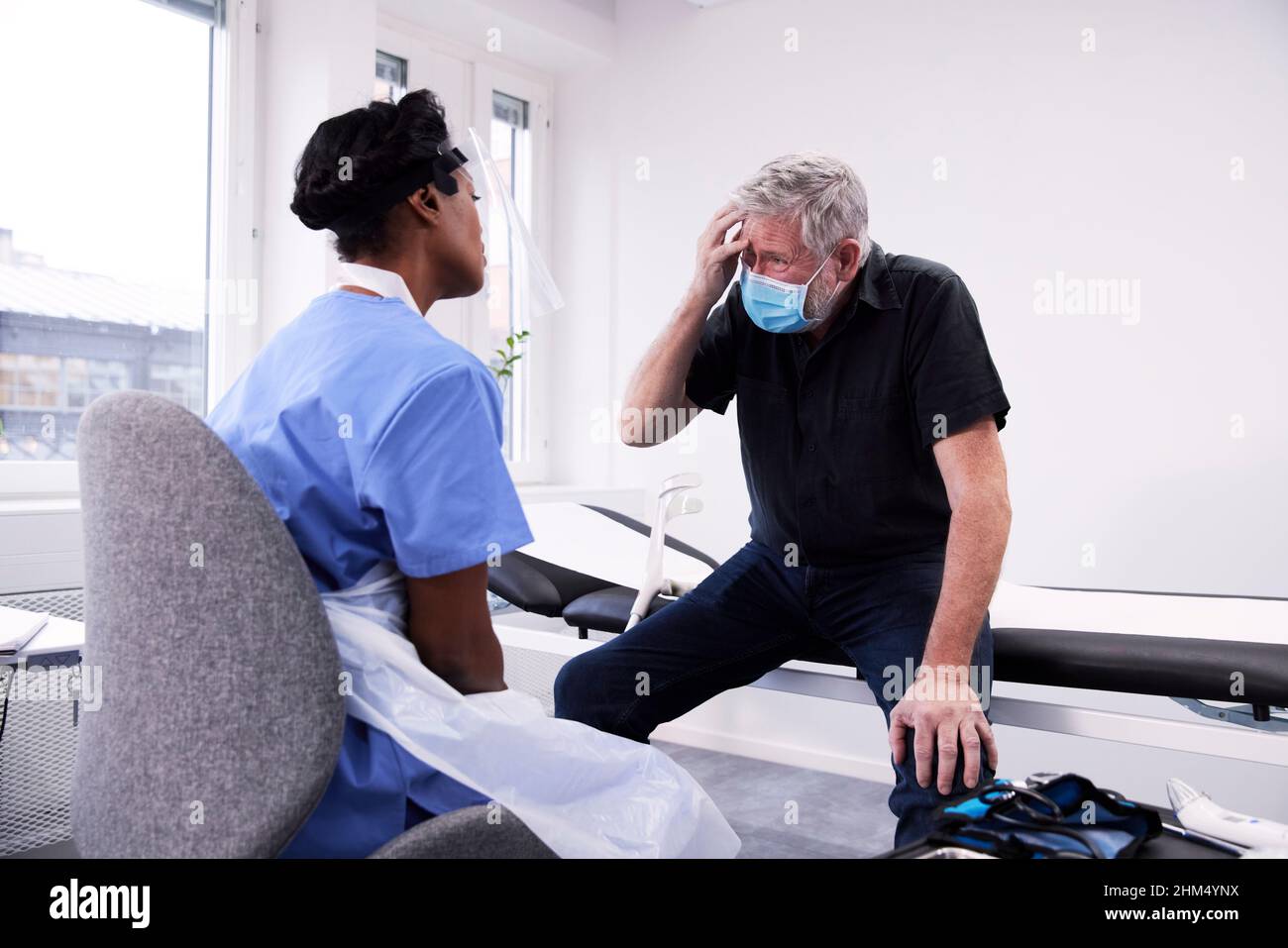 Senior man having doctor appointment Stock Photo - Alamy