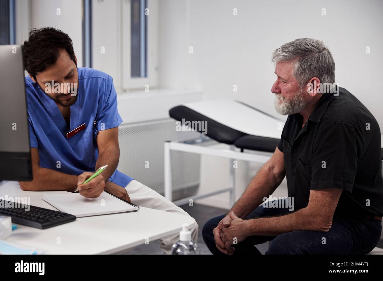 Senior man having doctor appointment Stock Photo - Alamy