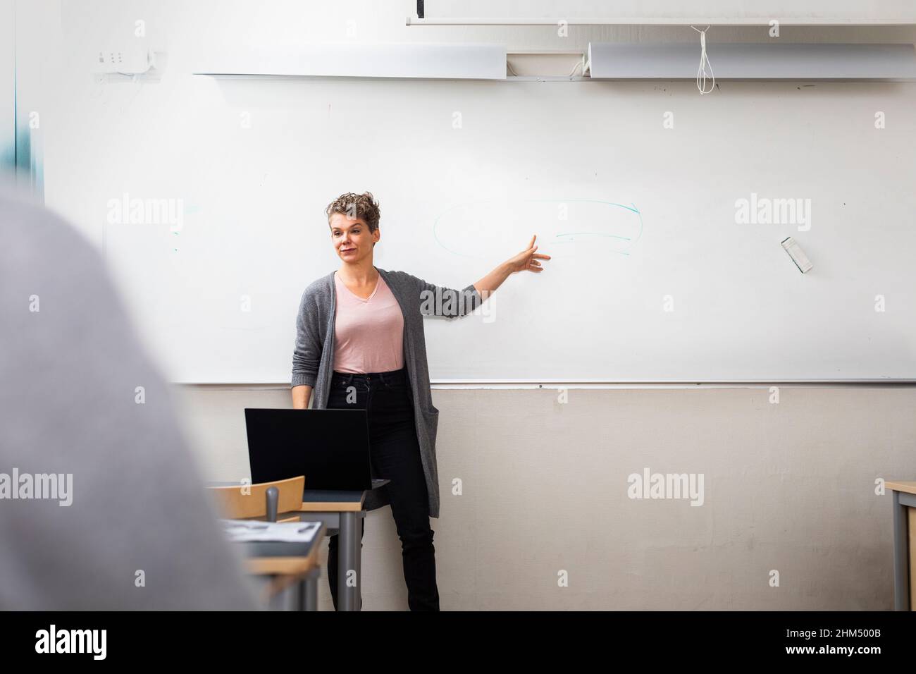 Teacher in classroom Stock Photo - Alamy