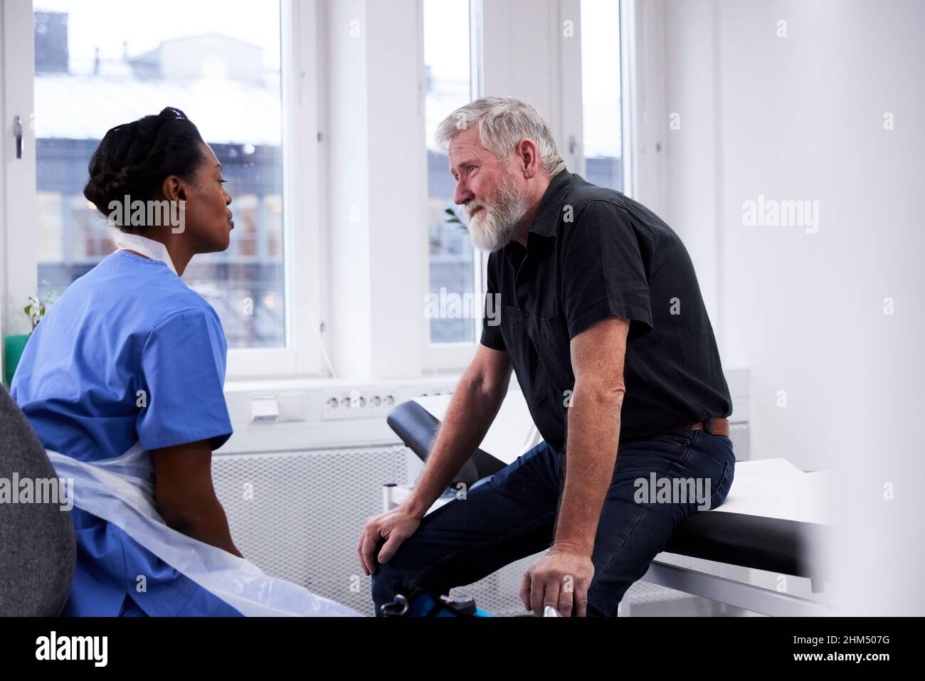 Senior man having doctor appointment Stock Photo - Alamy
