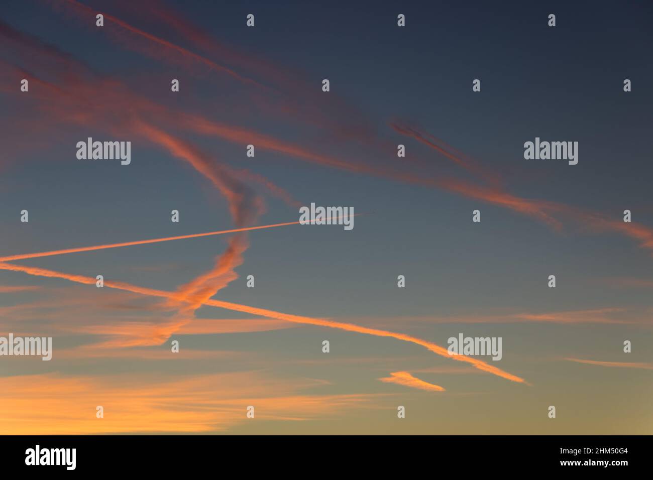 Low angle view of a plane track on a sunset sky - great for backgrounds ...