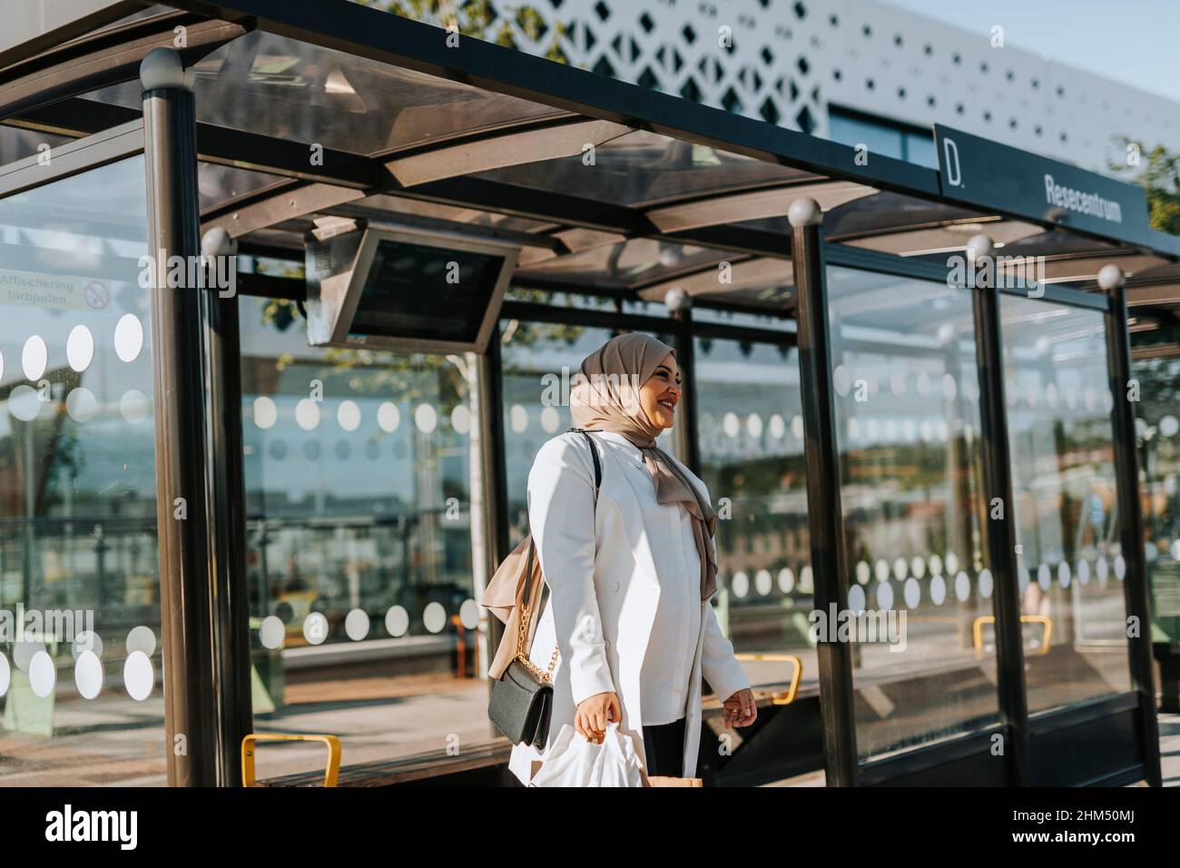 Woman standing bus stop hi-res stock photography and images - Alamy