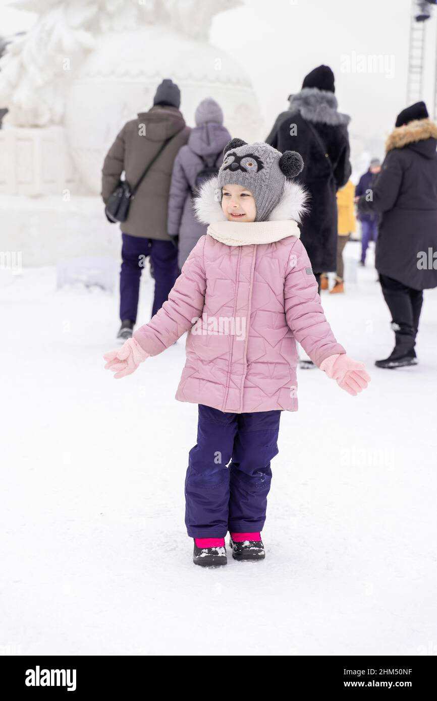 kid happy at ice sculpture festival on winter day Stock Photo - Alamy