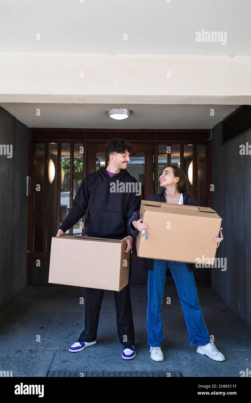Young couple carrying furniture hi-res stock photography and images - Alamy
