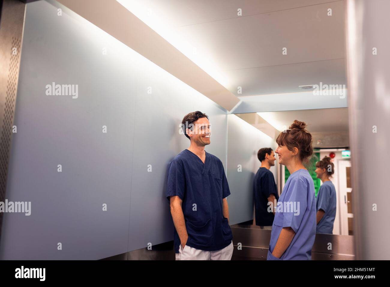 Medical staff talking in hospital elevator Stock Photo - Alamy