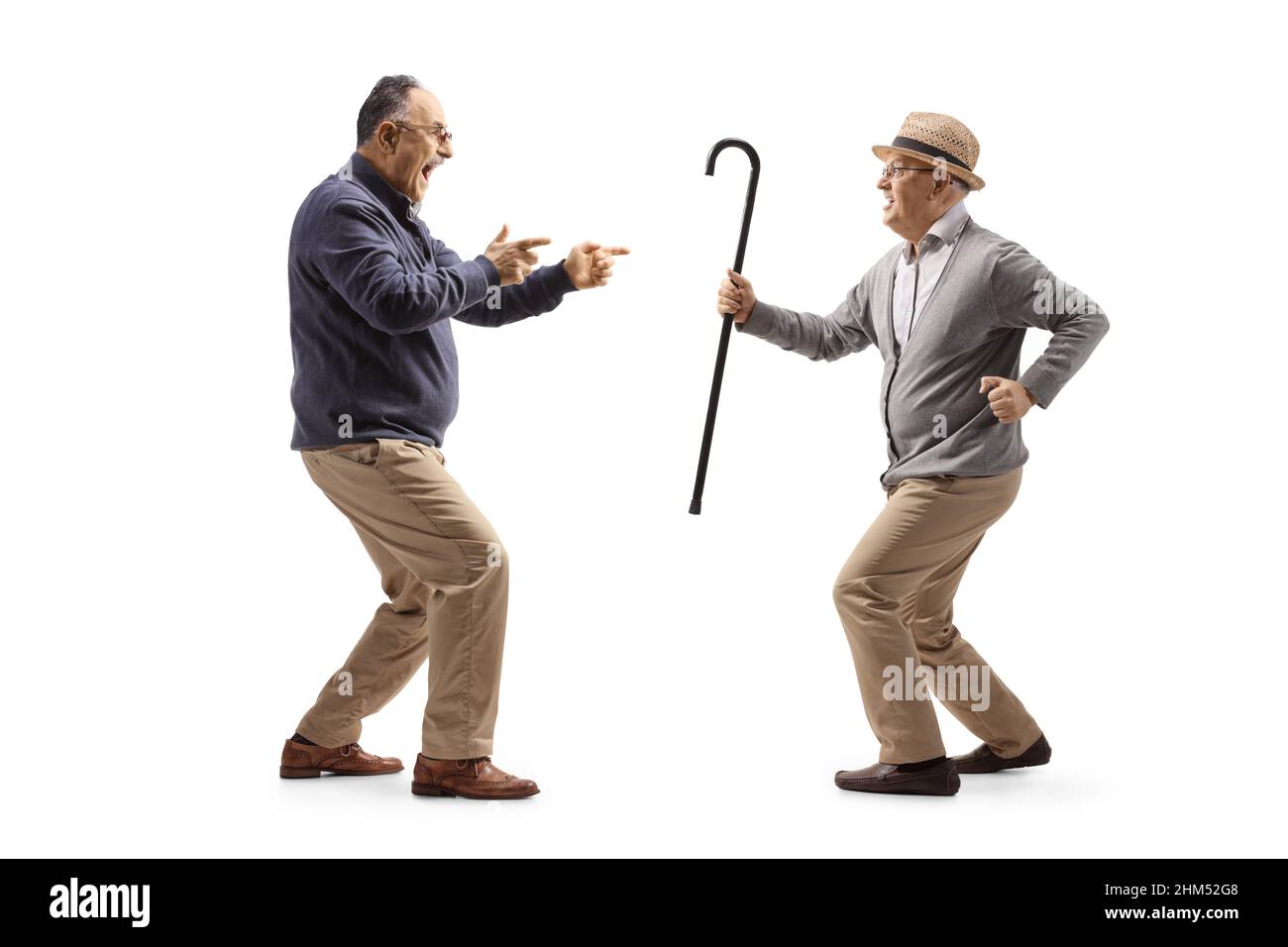 Mature man and a senior dancing isolated on white background Stock ...