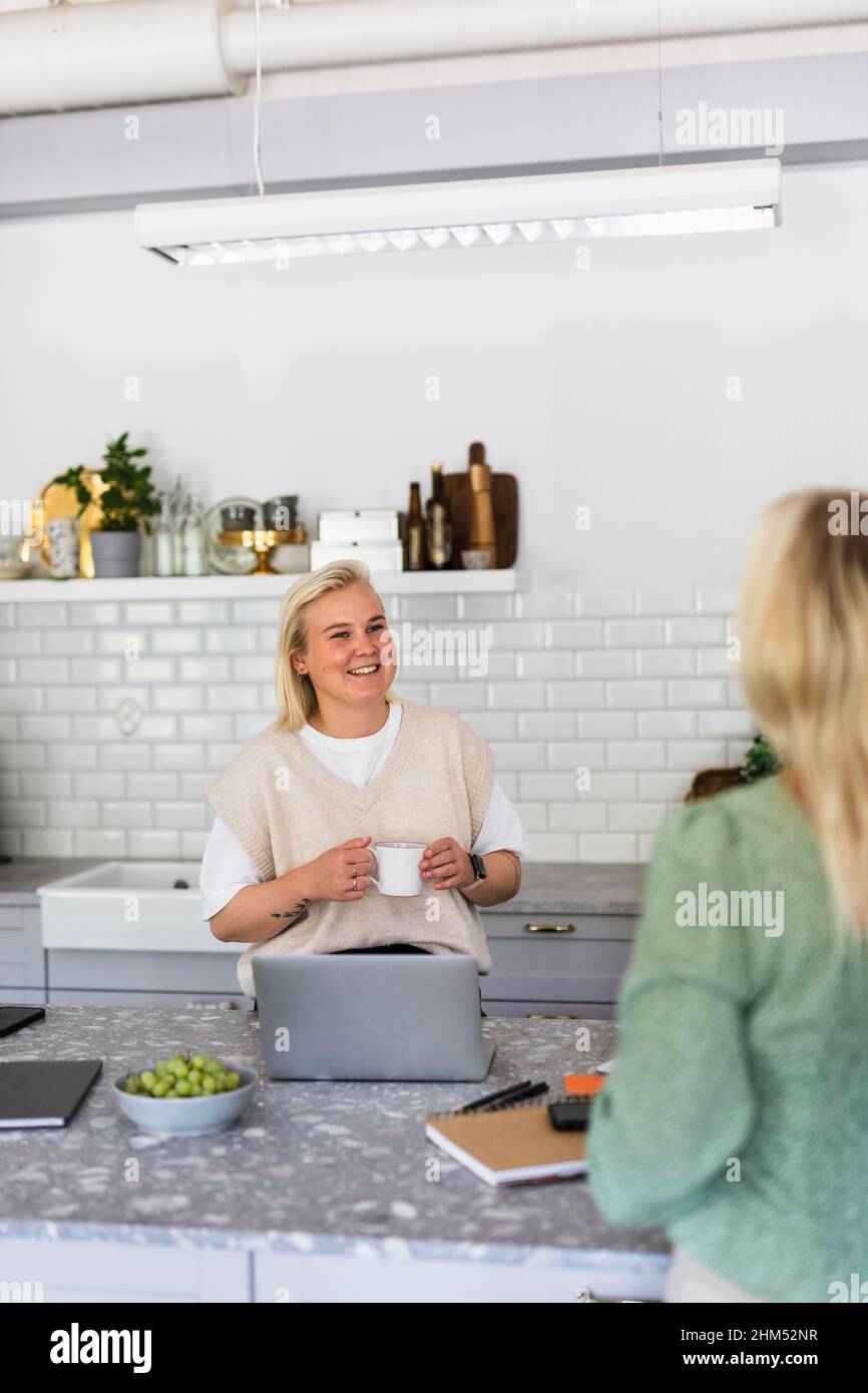 Women working in kitchen Stock Photo - Alamy