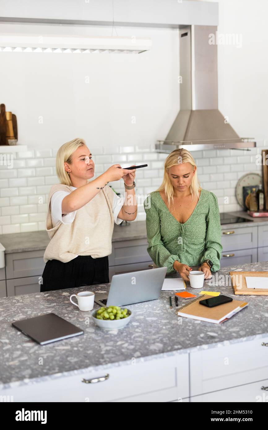 Women working in kitchen Stock Photo - Alamy