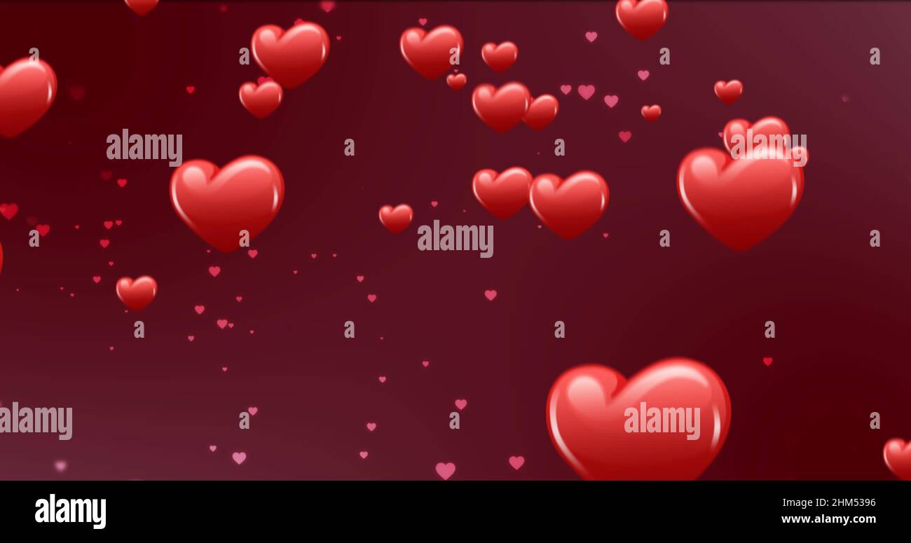 Image of red hearts icons floating on red background Stock Photo - Alamy