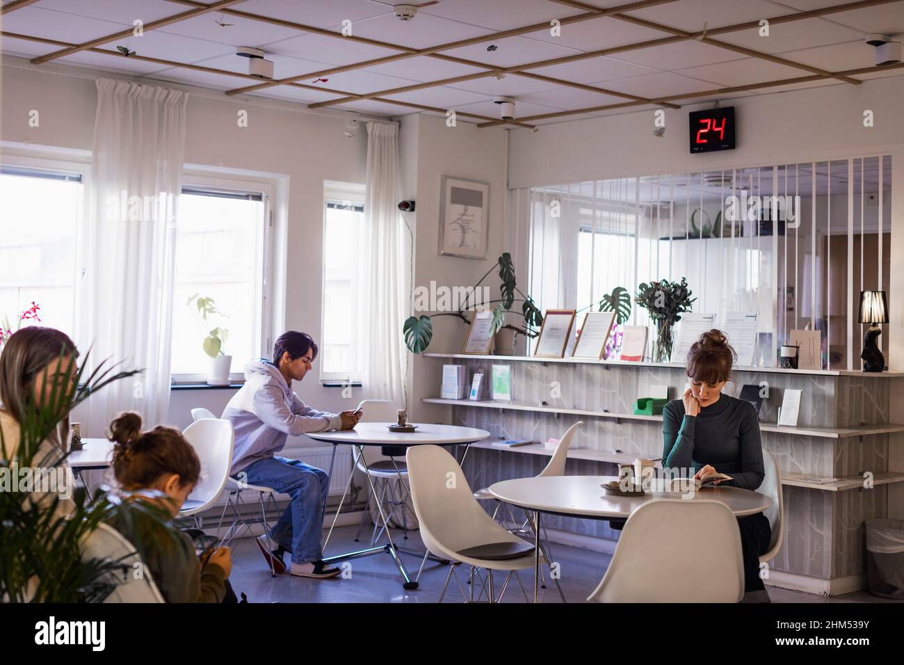 People sitting in waiting room Stock Photo - Alamy