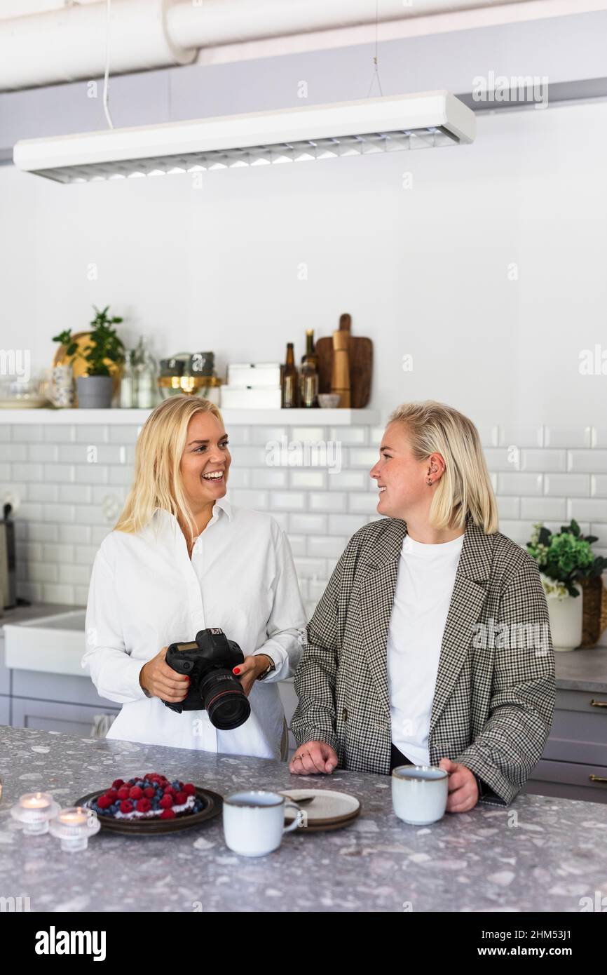 Women working in kitchen Stock Photo - Alamy