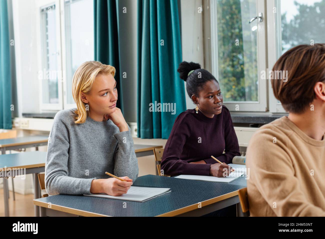 Students learning in classroom Stock Photo - Alamy