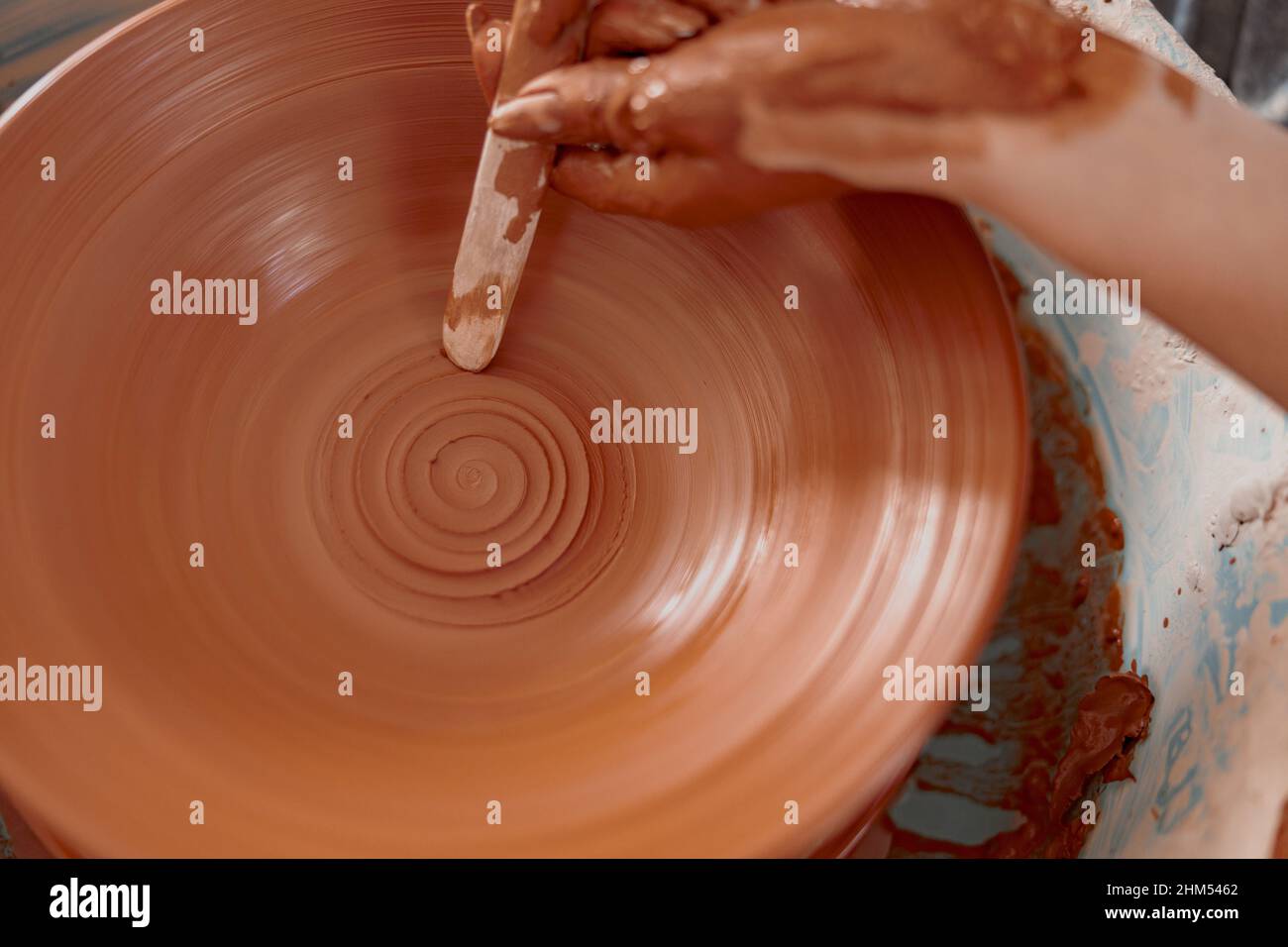Handmade artist creating earthen bowl on circle in art studio Stock ...