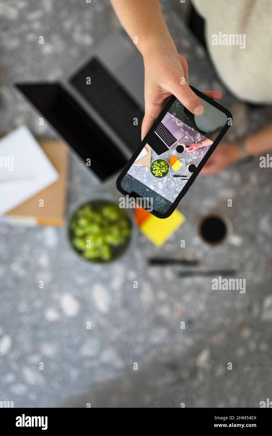 Woman using cell phone to take picture Stock Photo - Alamy