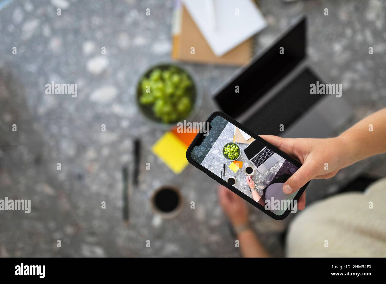 Woman using cell phone to take picture Stock Photo - Alamy