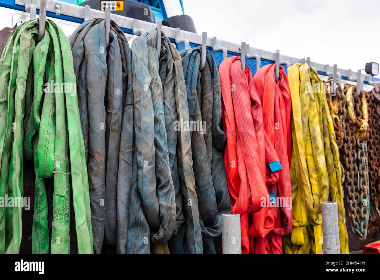 Colorful ropes hanging on hooks Stock Photo - Alamy